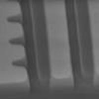 L-shaped fiber-chip grating couplers with high directionality and low ...